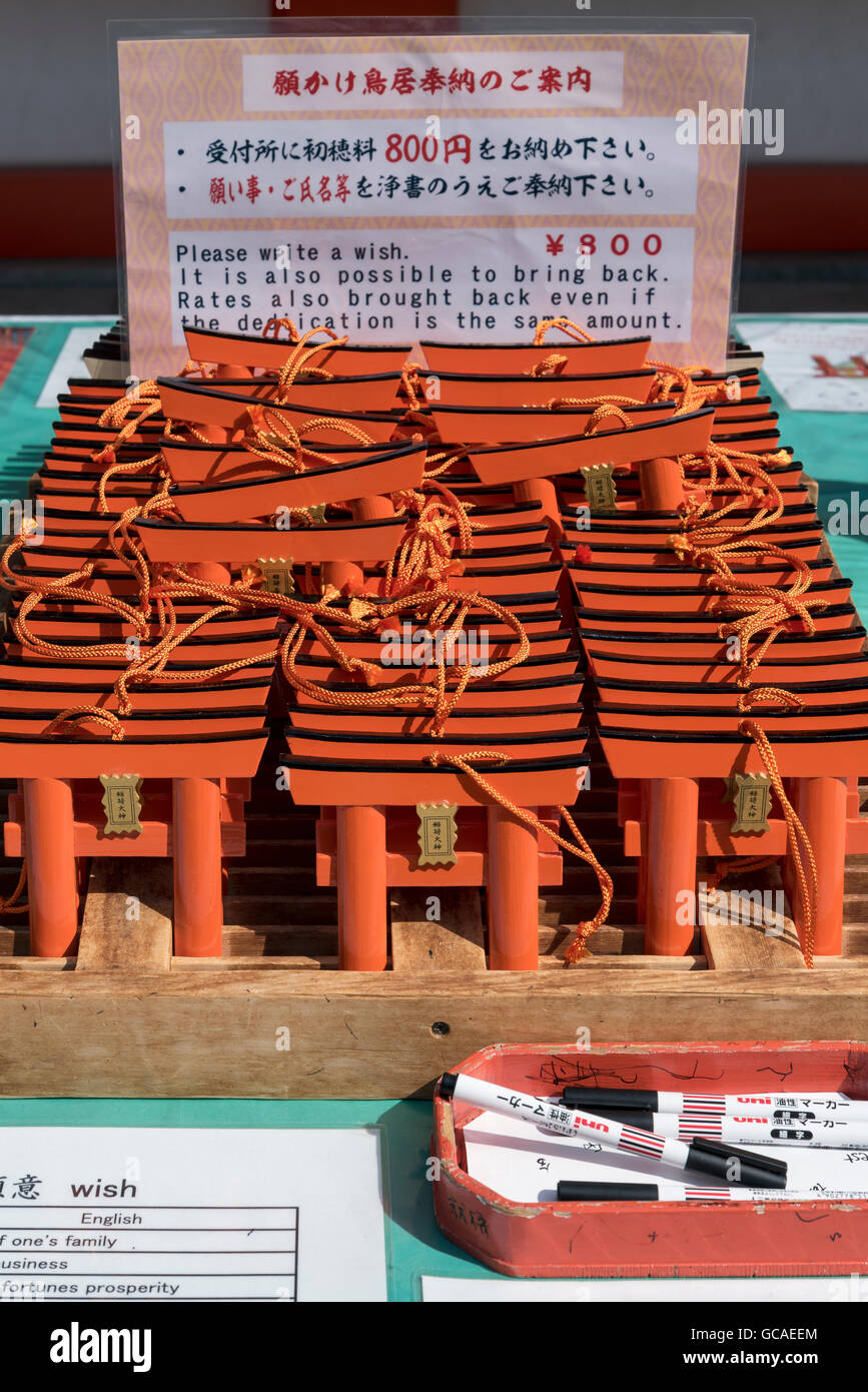 Ema wish plaques in the shape of orange torii gate at Fushimi Inari ...