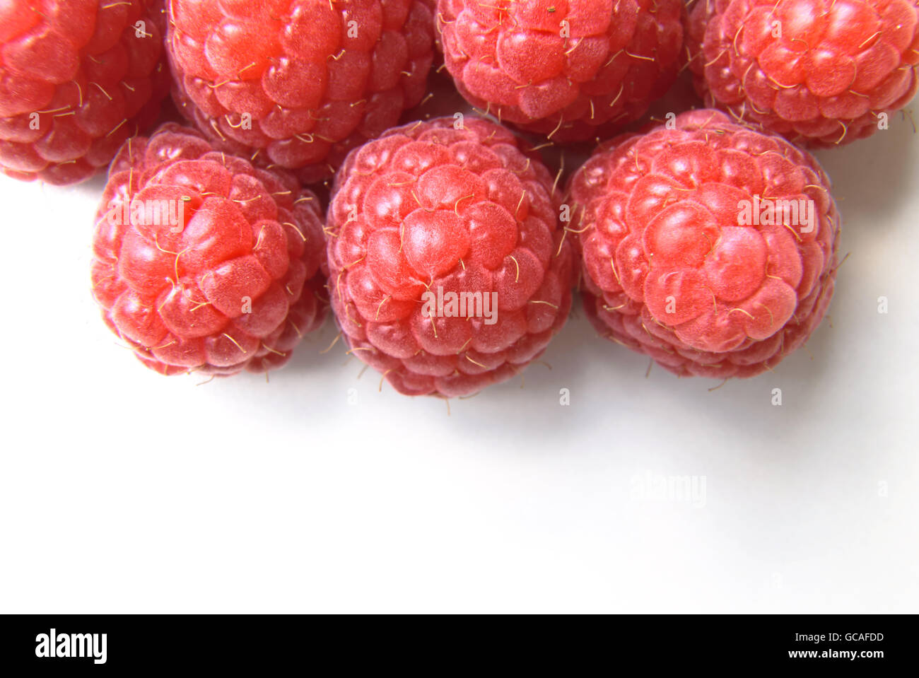 closeup of a bunch of red raspberries Stock Photo - Alamy
