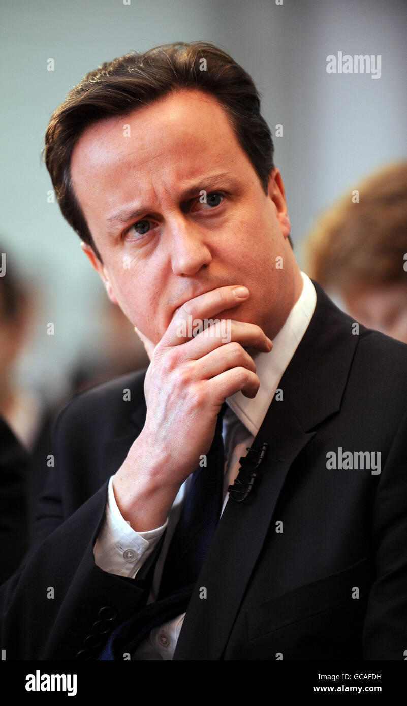 Conservative Party Leader, David Cameron, watches party videos before ...
