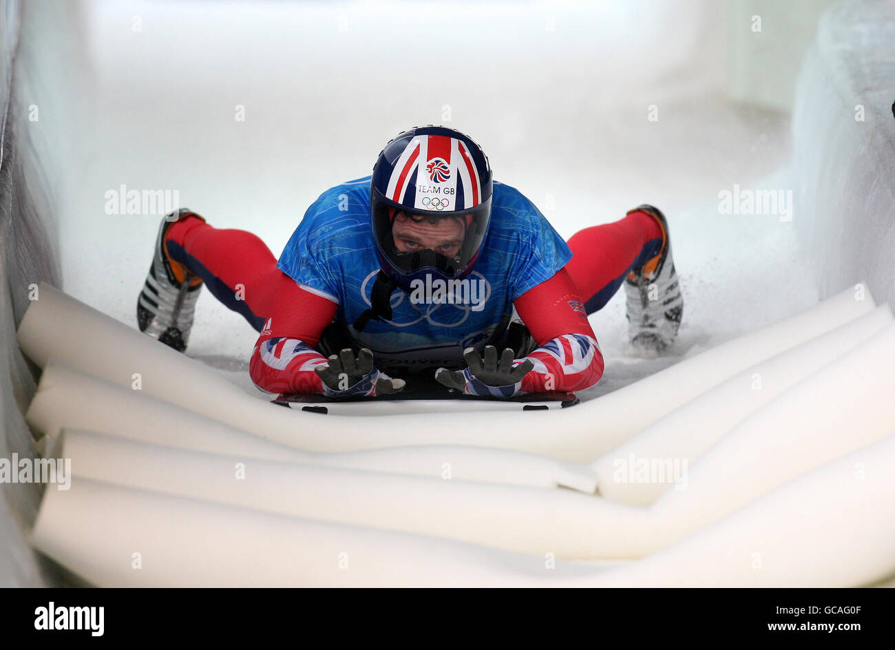 Great Britain's Adam Pengilly stops himself with a foam cushion during ...