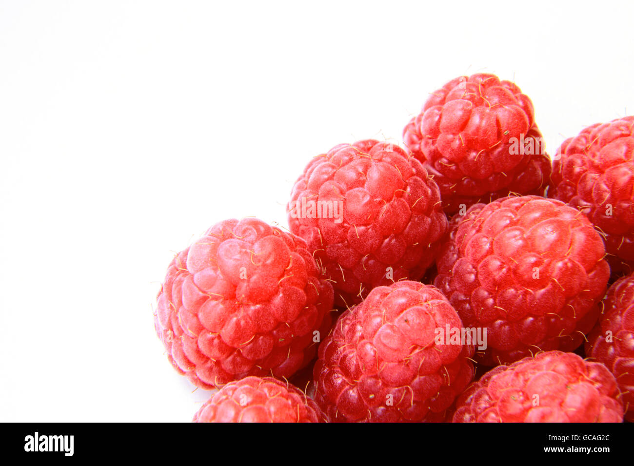 closeup of a bunch of red raspberries Stock Photo - Alamy
