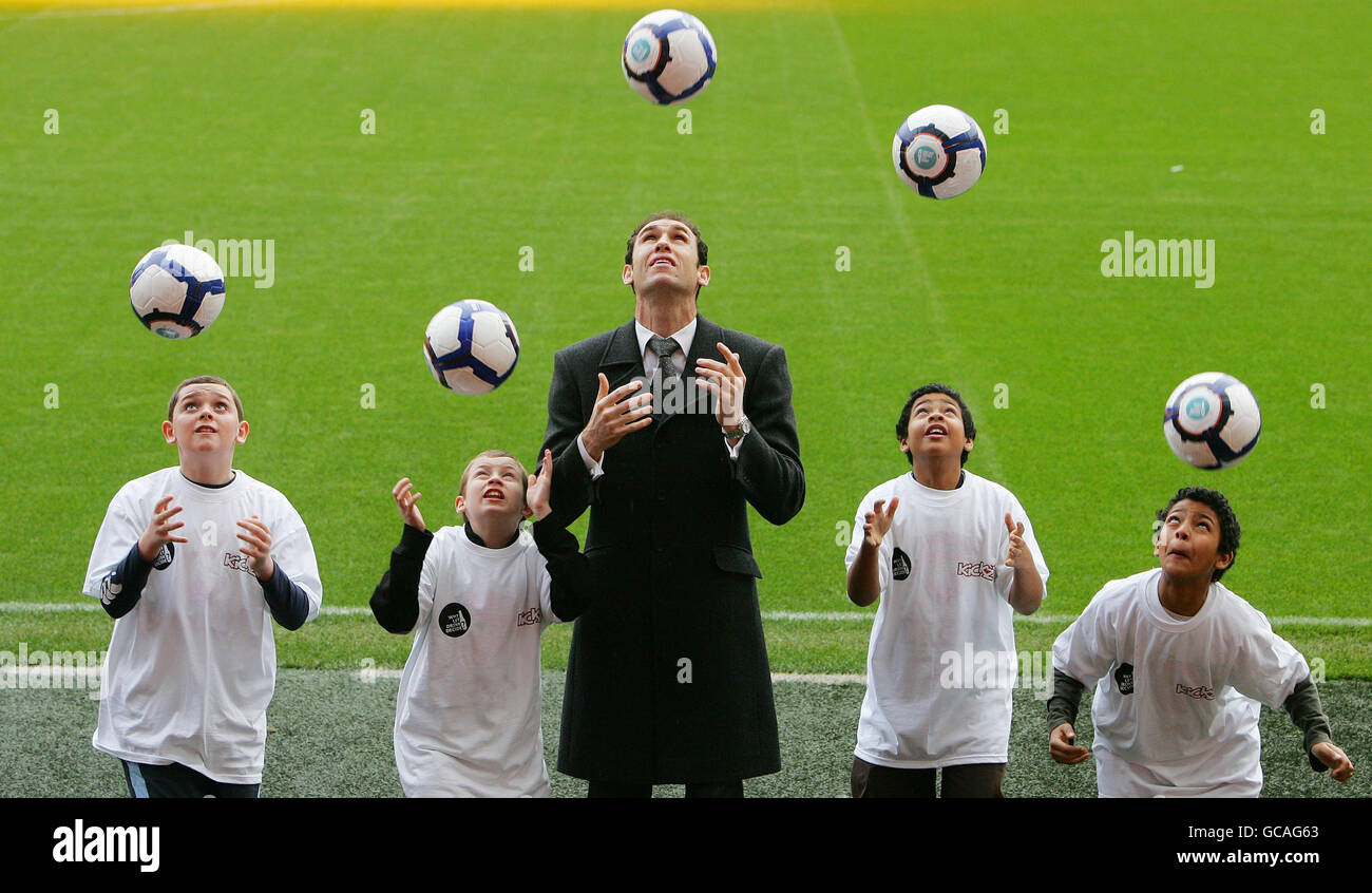 Ex England and Arsenal defender Martin Keown with young people from the ...