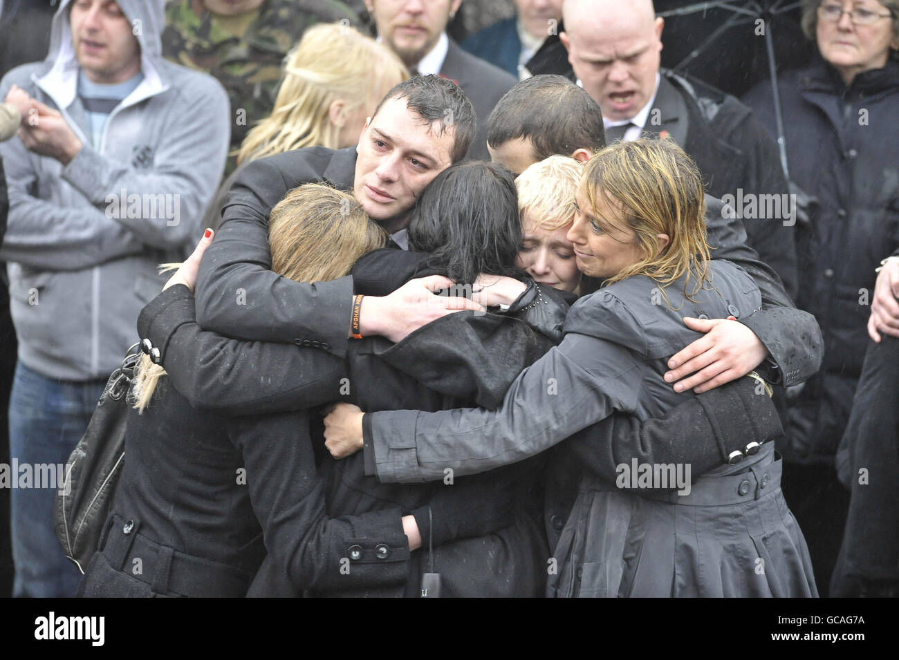 Grief mourning hugging hi-res stock photography and images - Alamy