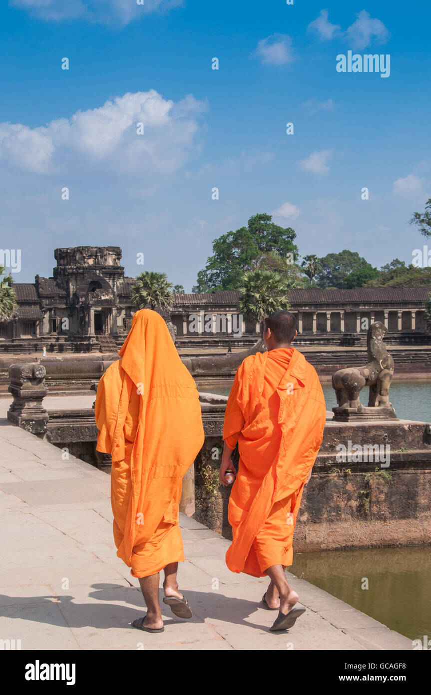 Buddhist Monks In Their Bright Orange Robes Visit The Angkor Wat Temple