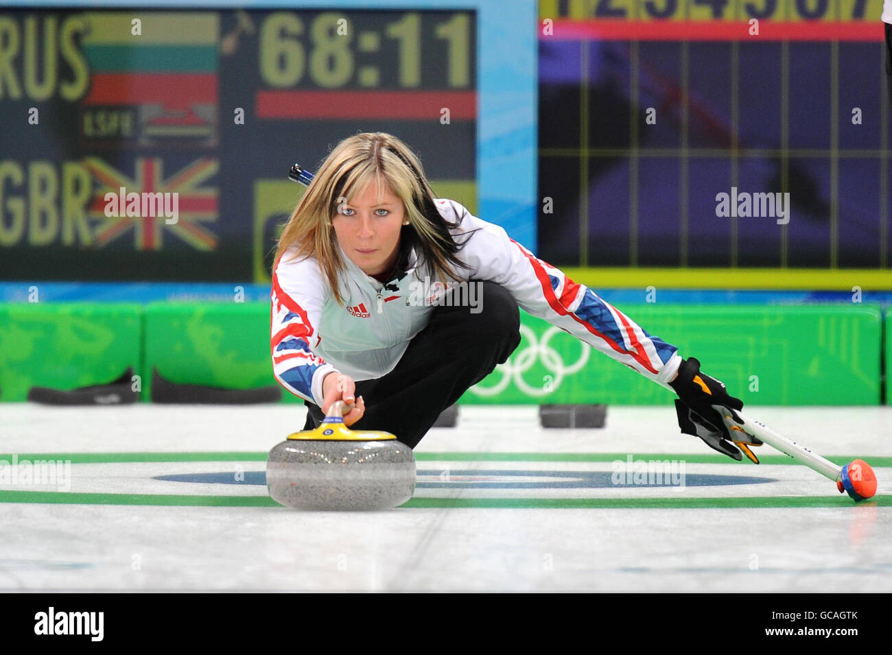 In action in the womens curling competition hi-res stock photography ...