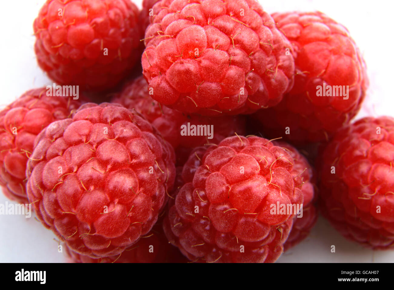closeup of a bunch of red raspberries Stock Photo - Alamy