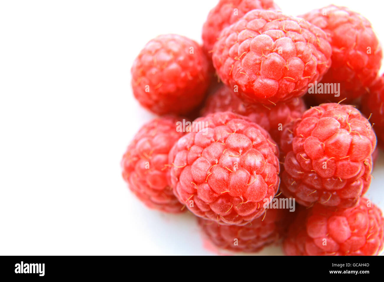 closeup of a bunch of red raspberries Stock Photo - Alamy