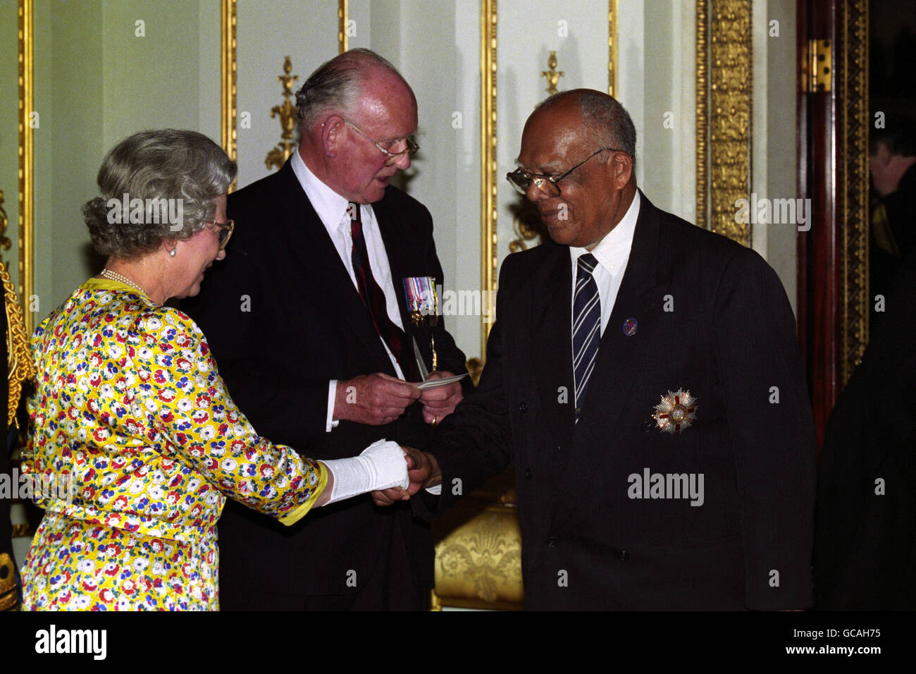 THE QUEEN GREETS SIR HOWARD COOKE, THE GOVERNOR GENERAL OF JAMAICA AT ...