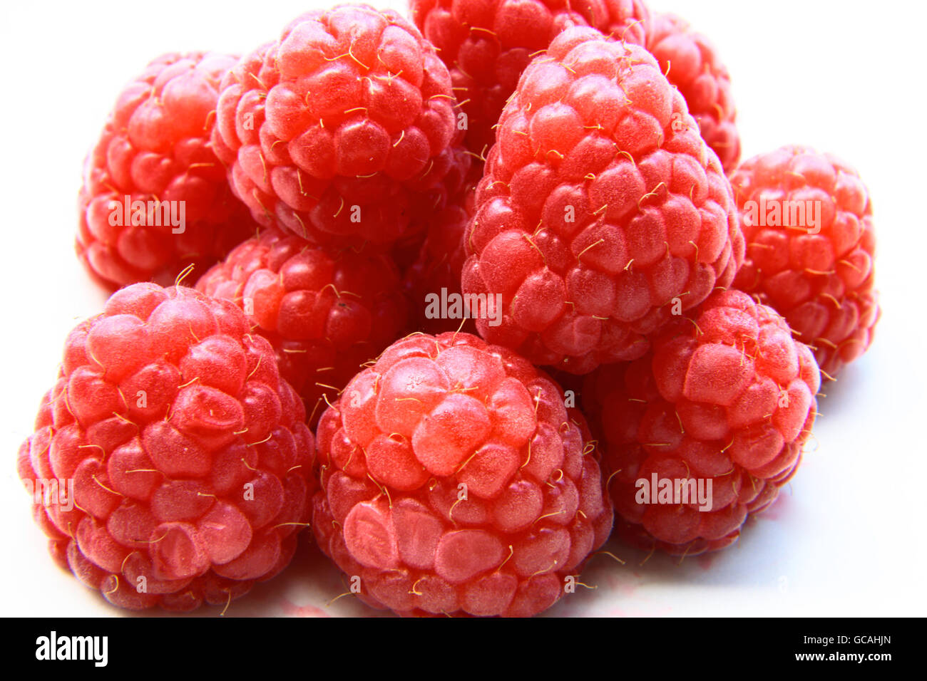 closeup of a bunch of red raspberries Stock Photo - Alamy