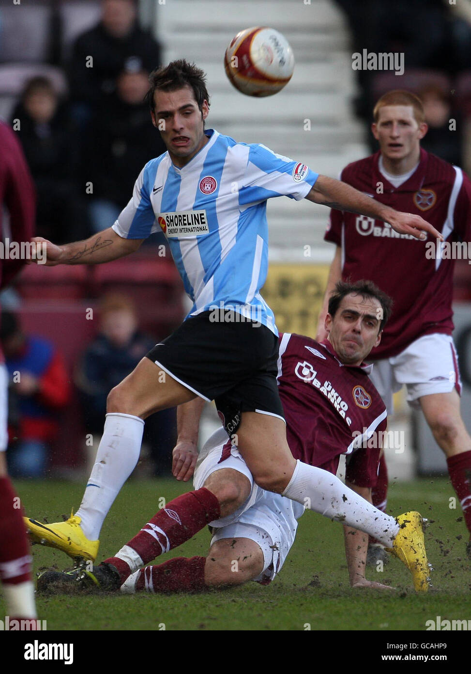 Hearts' David Kucharski (floor) challenges Hamilton's Flavio Paixao ...