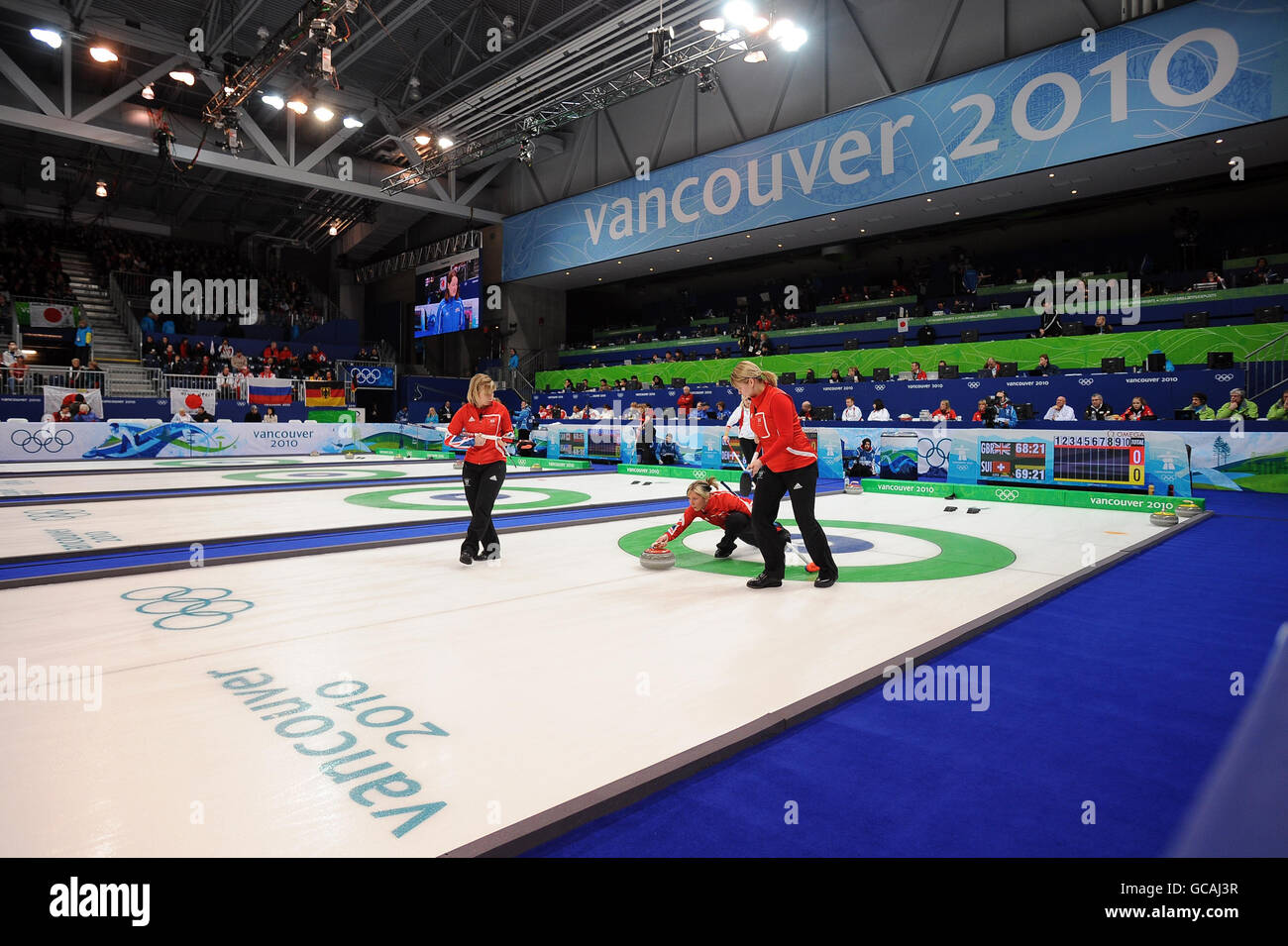 In action in the womens curling competition hi-res stock photography ...