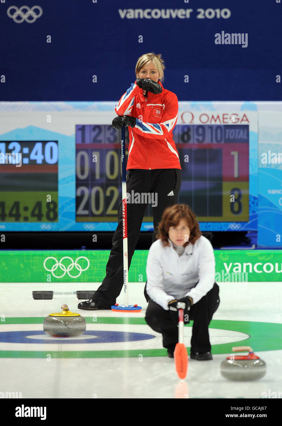 Great Britain's skip Eve Muirhead (top) watches over Switzerland skip ...