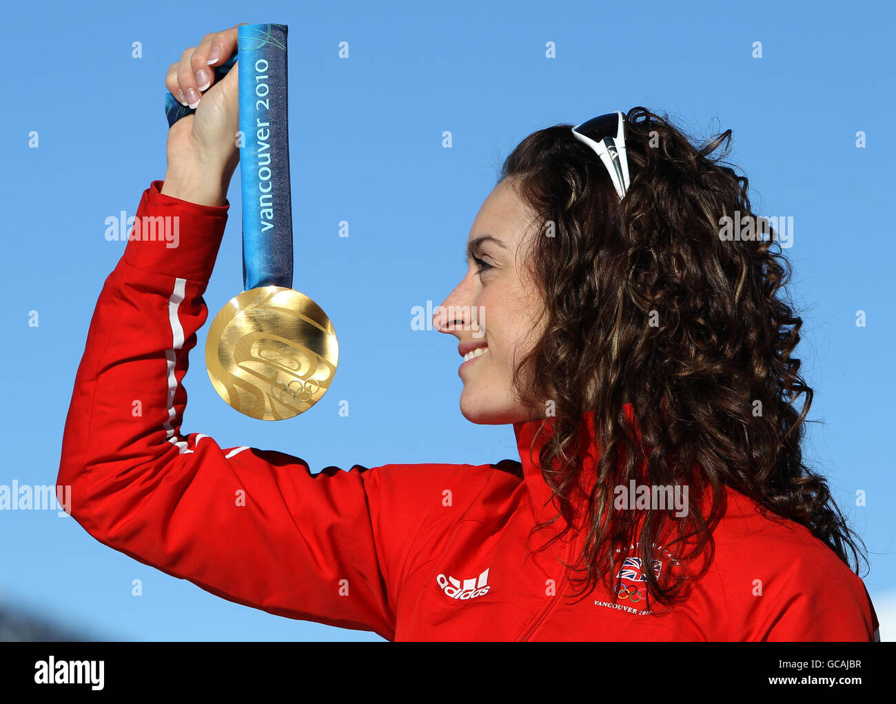 Great Britain's Amy Williams looks at her Olympic gold medal high in ...