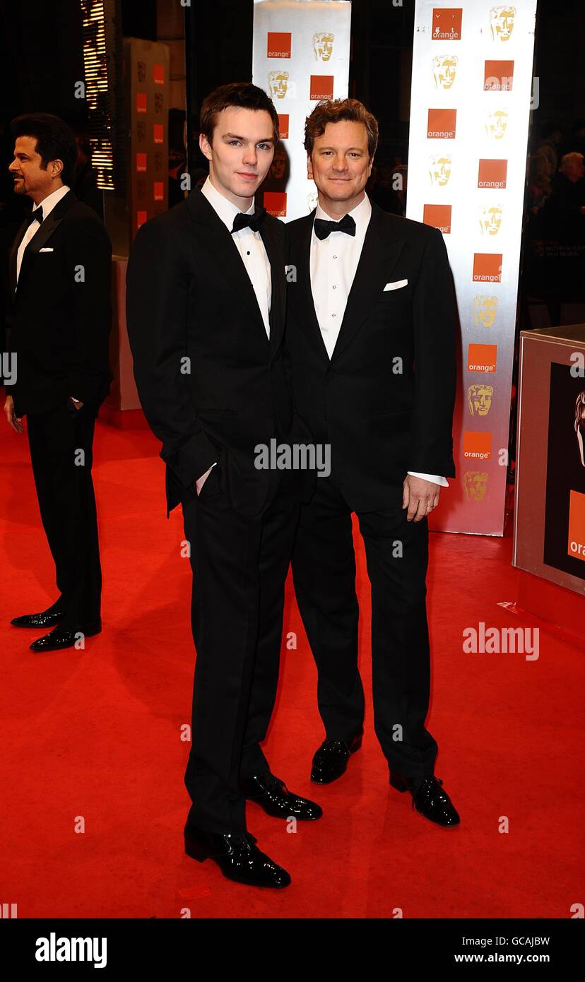 Nicholas Hoult (left) and Colin Firth arriving for the Orange British ...