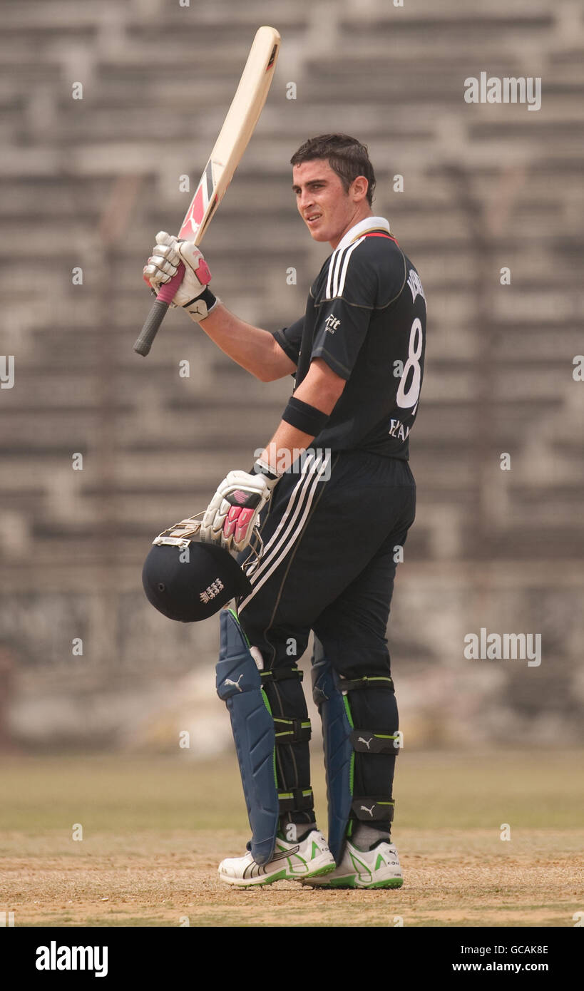 Cricket batsman raising bat hi-res stock photography and images - Alamy