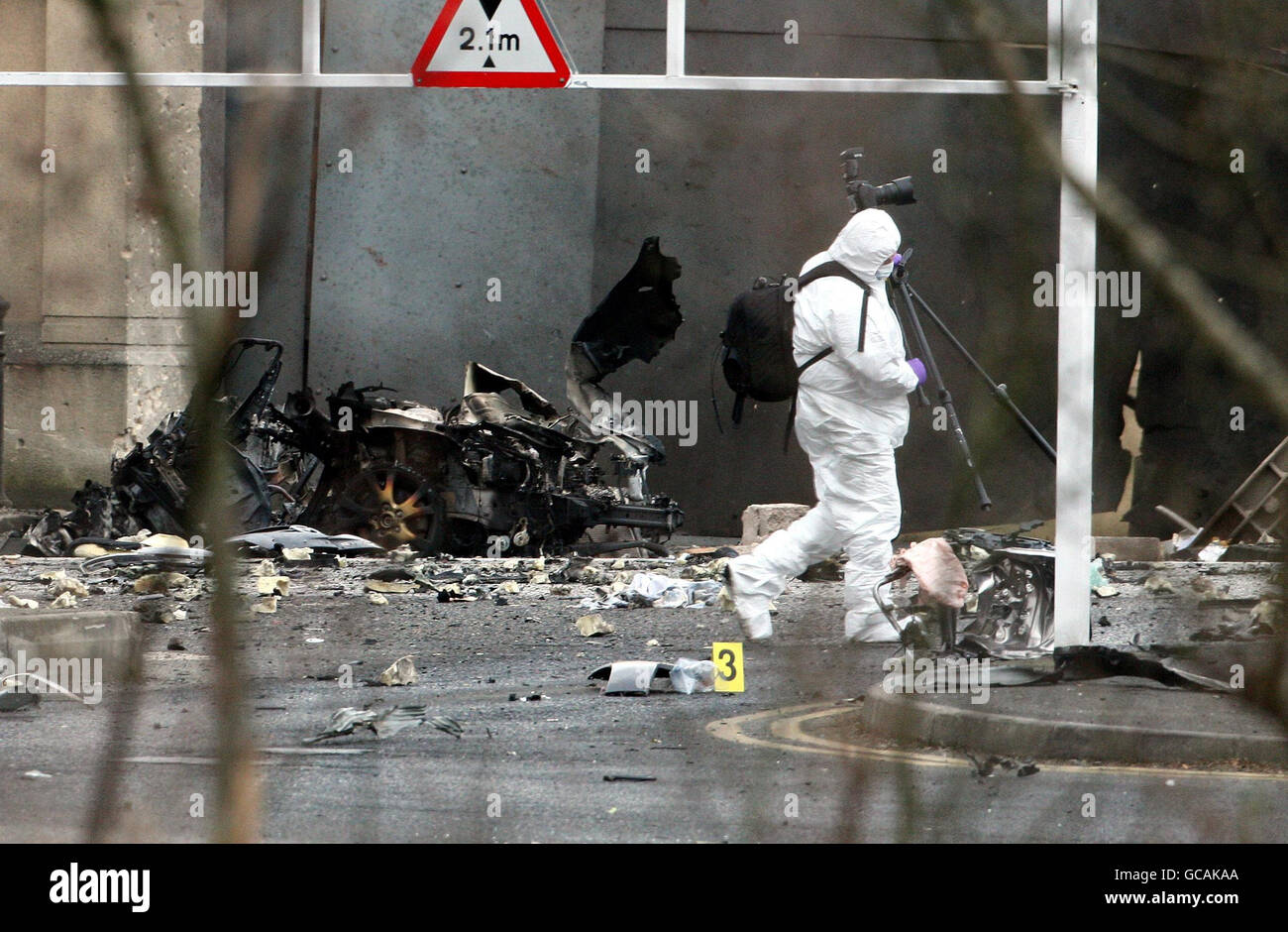Police forensic experts at the scene of a car bomb attack outside Newry ...