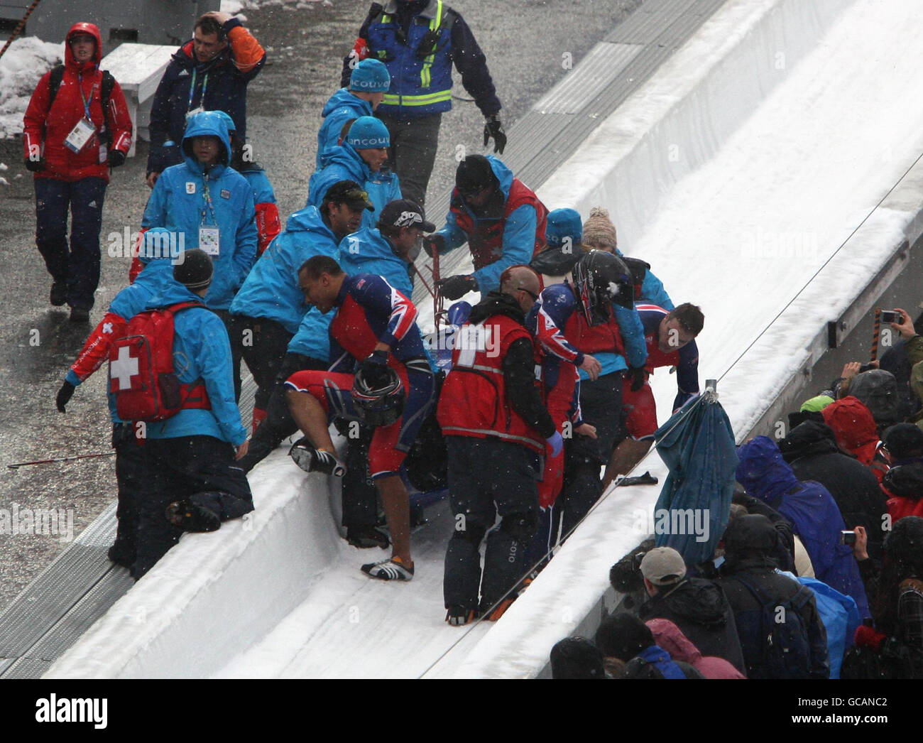 Great Britain are helped out of their sled after crashing during The ...