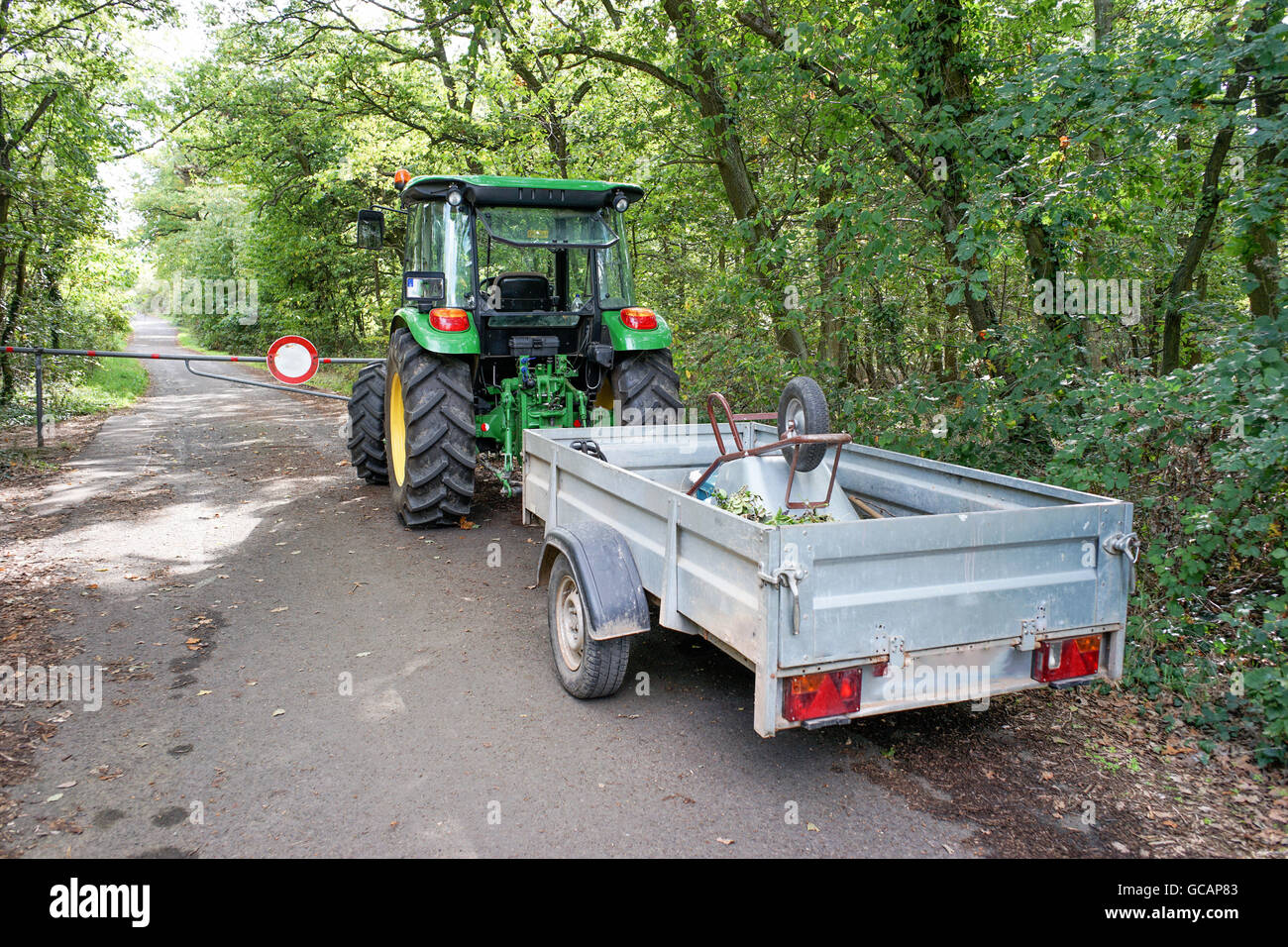 Tractor and trailer parking behind a closed road Stock Photo - Alamy