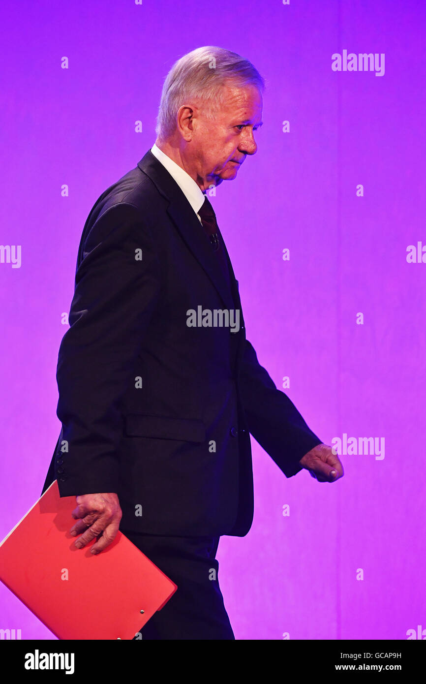 Sir John Chilcot leaves the stage after presenting The Iraq Inquiry ...
