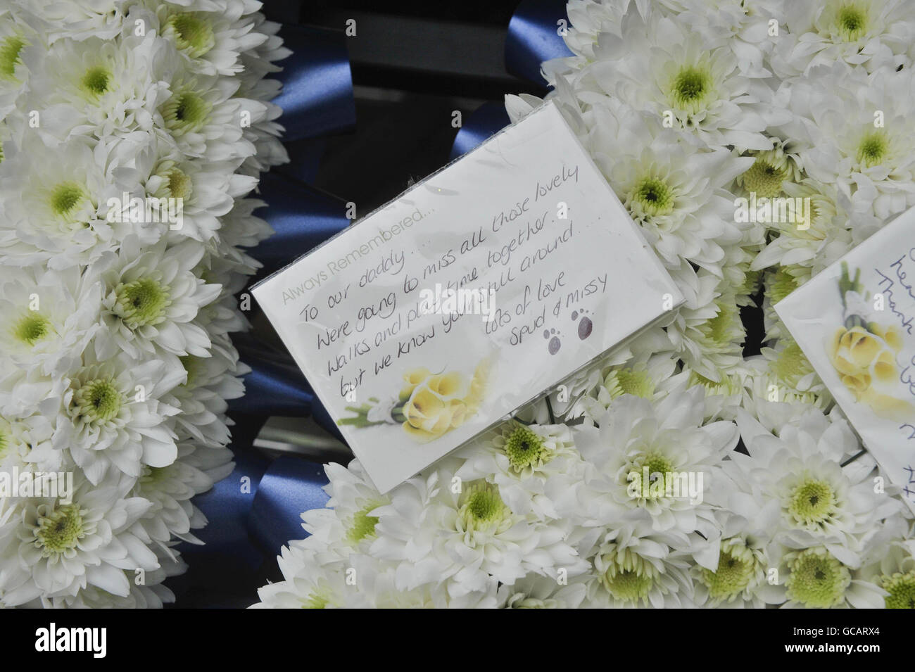 A message on a floral tribute at the funeral of Captain Daniel Read, 31 ...