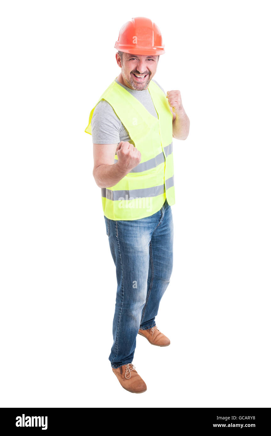 Full body of joyful successful constructor male enjoying a great ...