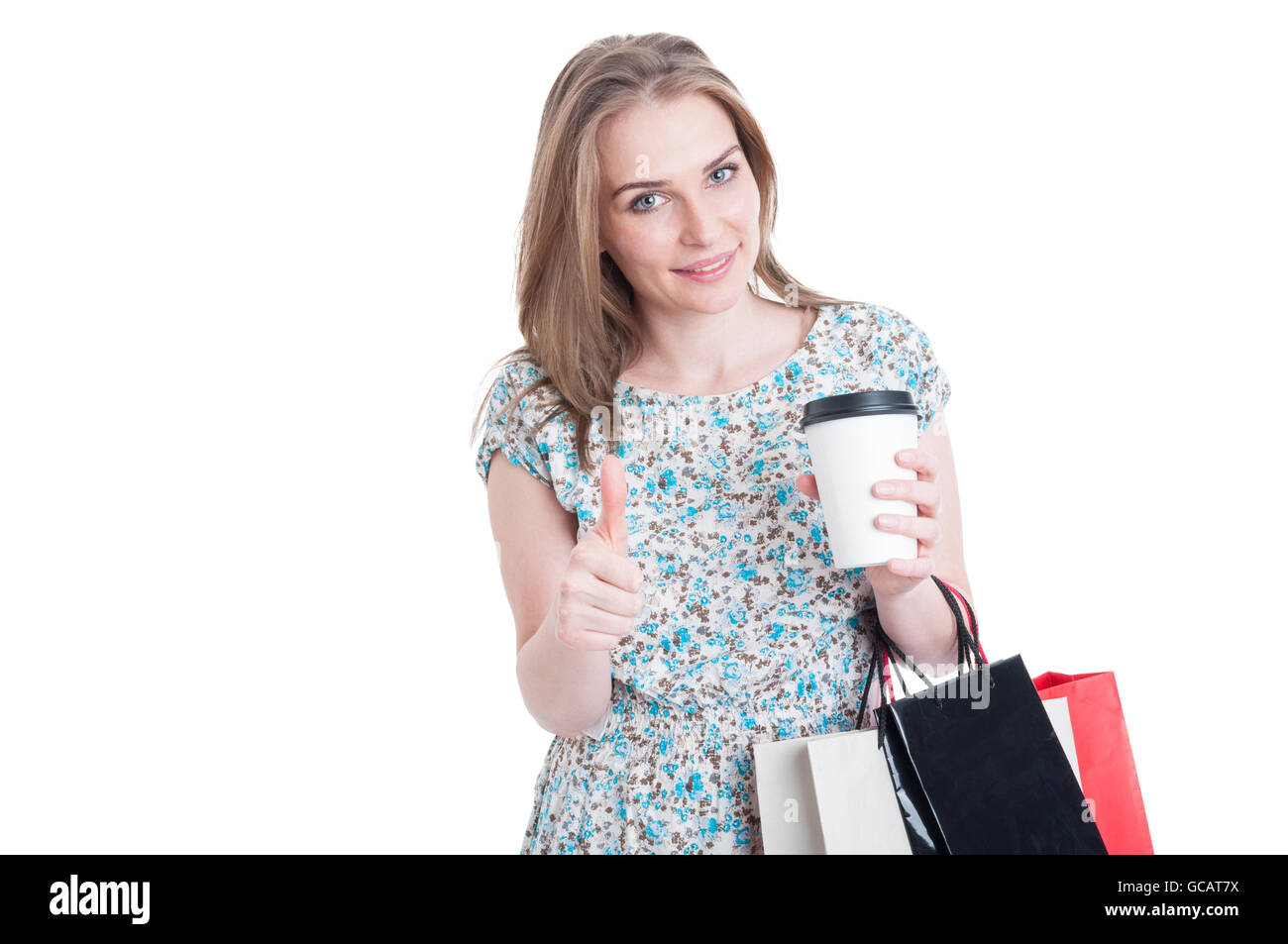 Shopper female with coffee and bags showing like sign or thumb up ...