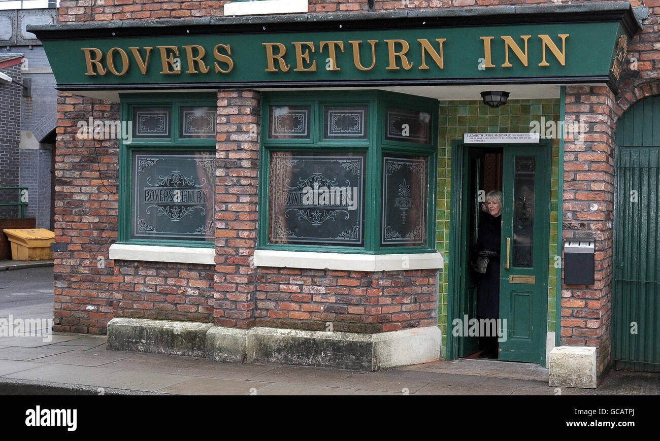 The Duchess of Cornwall comes out of the Rovers Return Pub during her ...