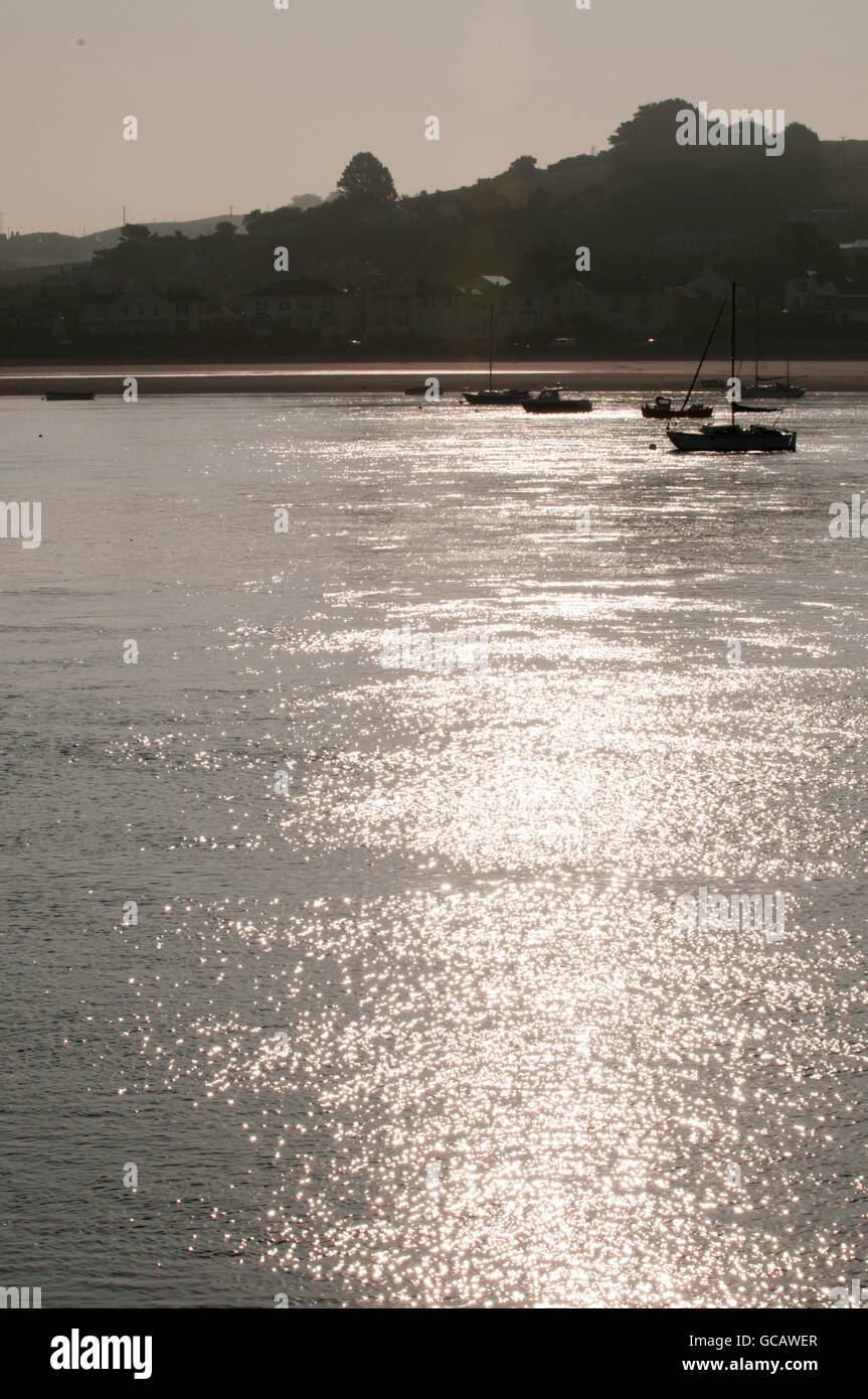 Sun rising over the water over the estuary leading to the ocean Stock ...