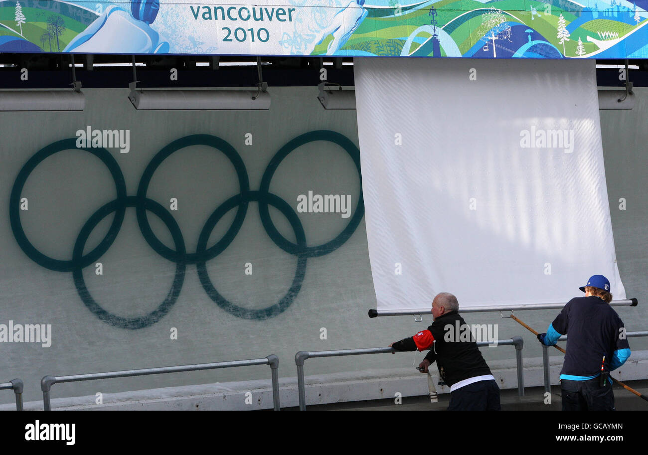 Officials pull covers over the track to protect it from sunlight at The ...