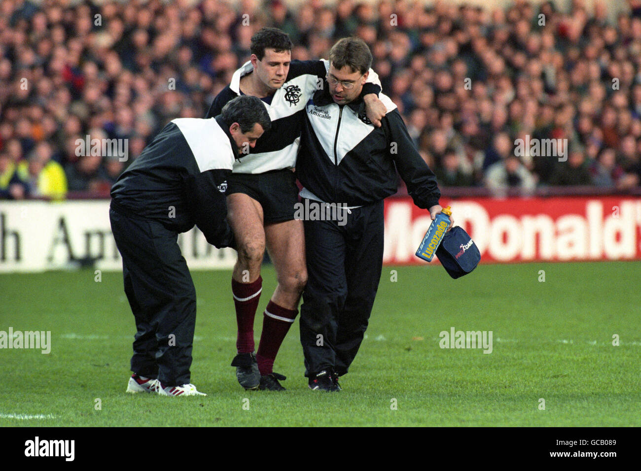 SCOTLAND'S SCOTT HASTINGS IS CARRIED OFF DURING THE SECOND HALF OF THE ...