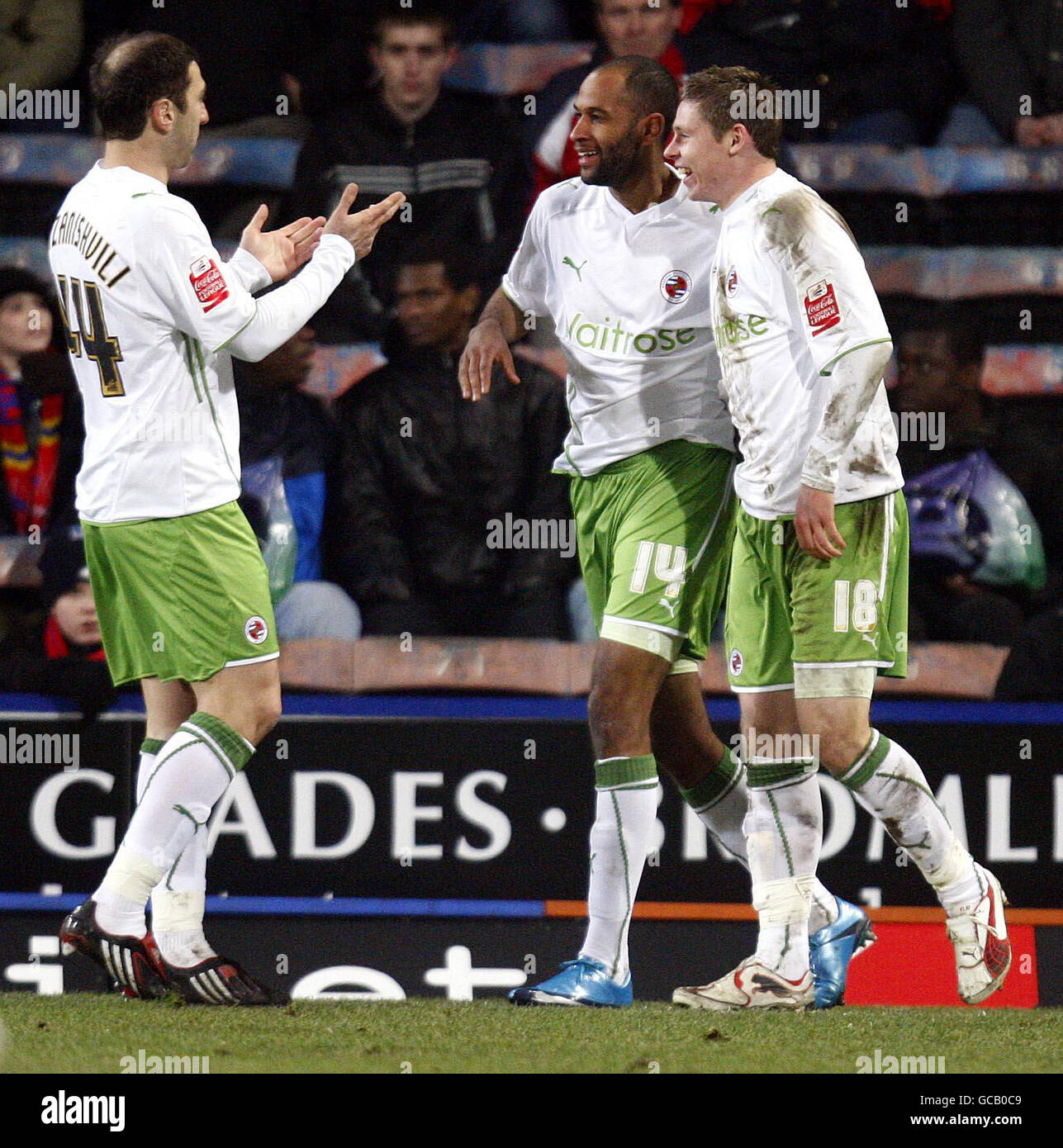 Reading's Jimmy Kebe (centre) celebrates his goal with teammates during ...