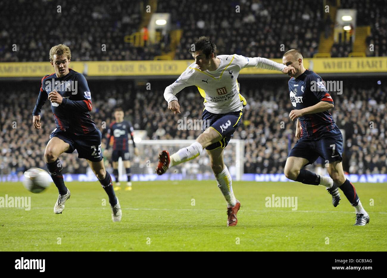 Tottenham Hotspur's Gareth Bale (centre) crosses the ball leading to an ...