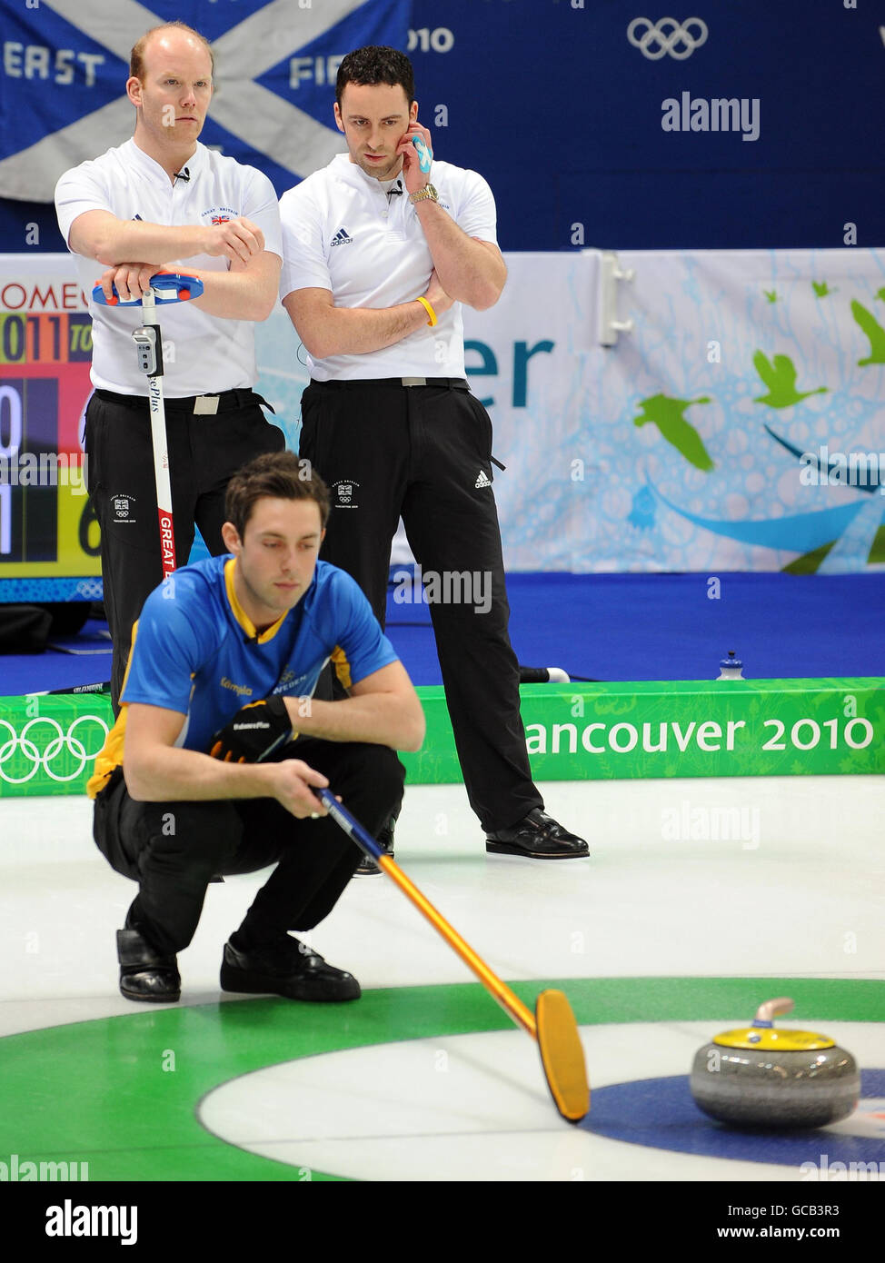 Great Britain's skip David Murdoch (right) and Ewan MacDonald watch the ...