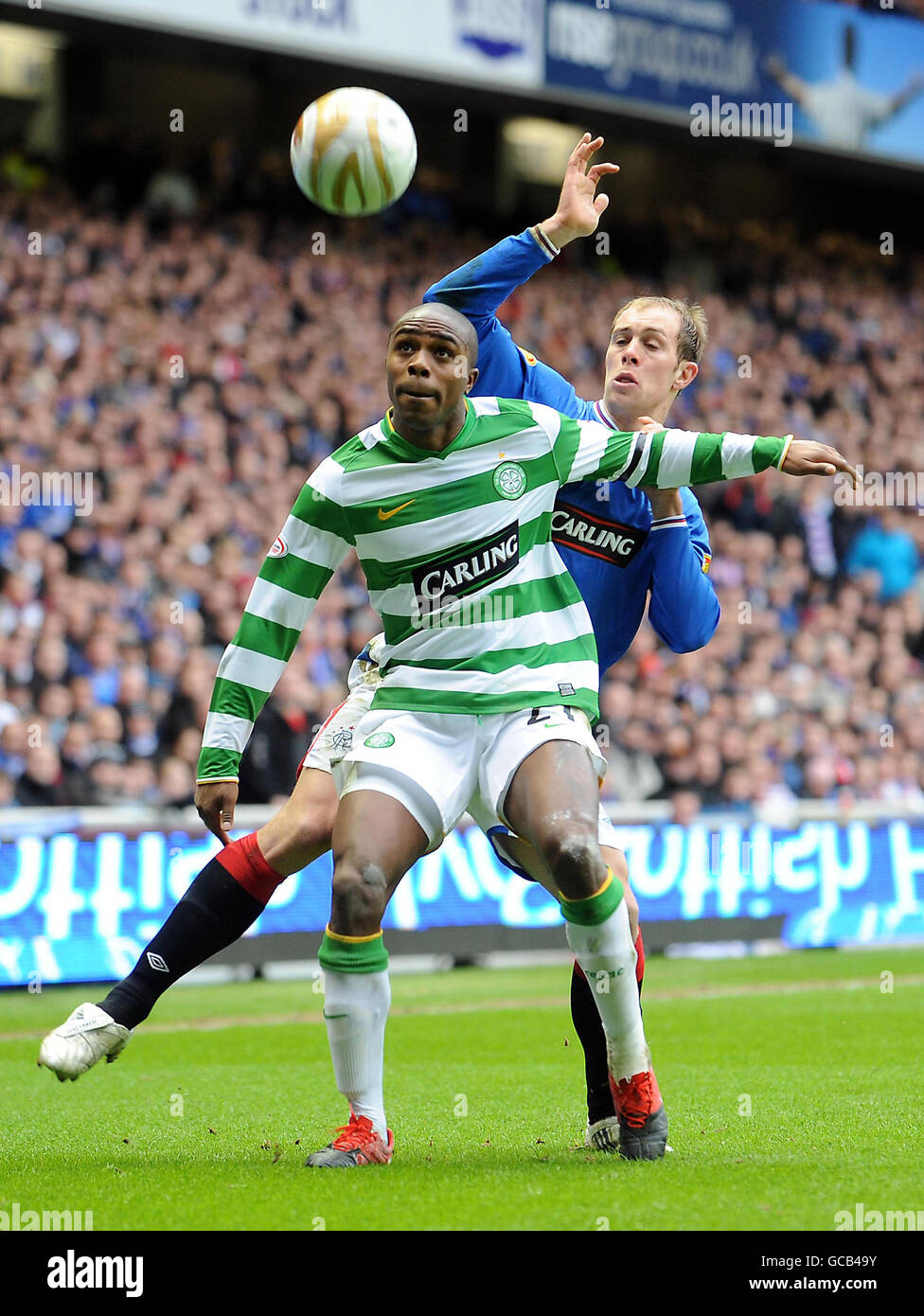 Celtic's Edson Braafheid and Rangers' Steven Whittaker (behind) battle ...