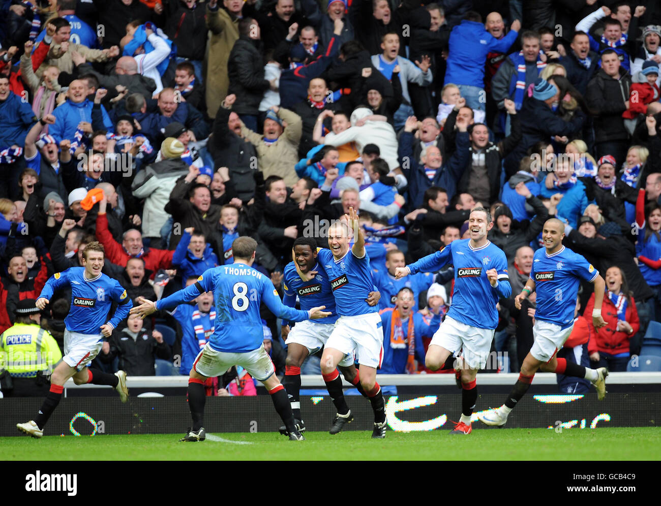 Rangers' Maurice Edu (centre) celebrates scoring the winning goal with ...