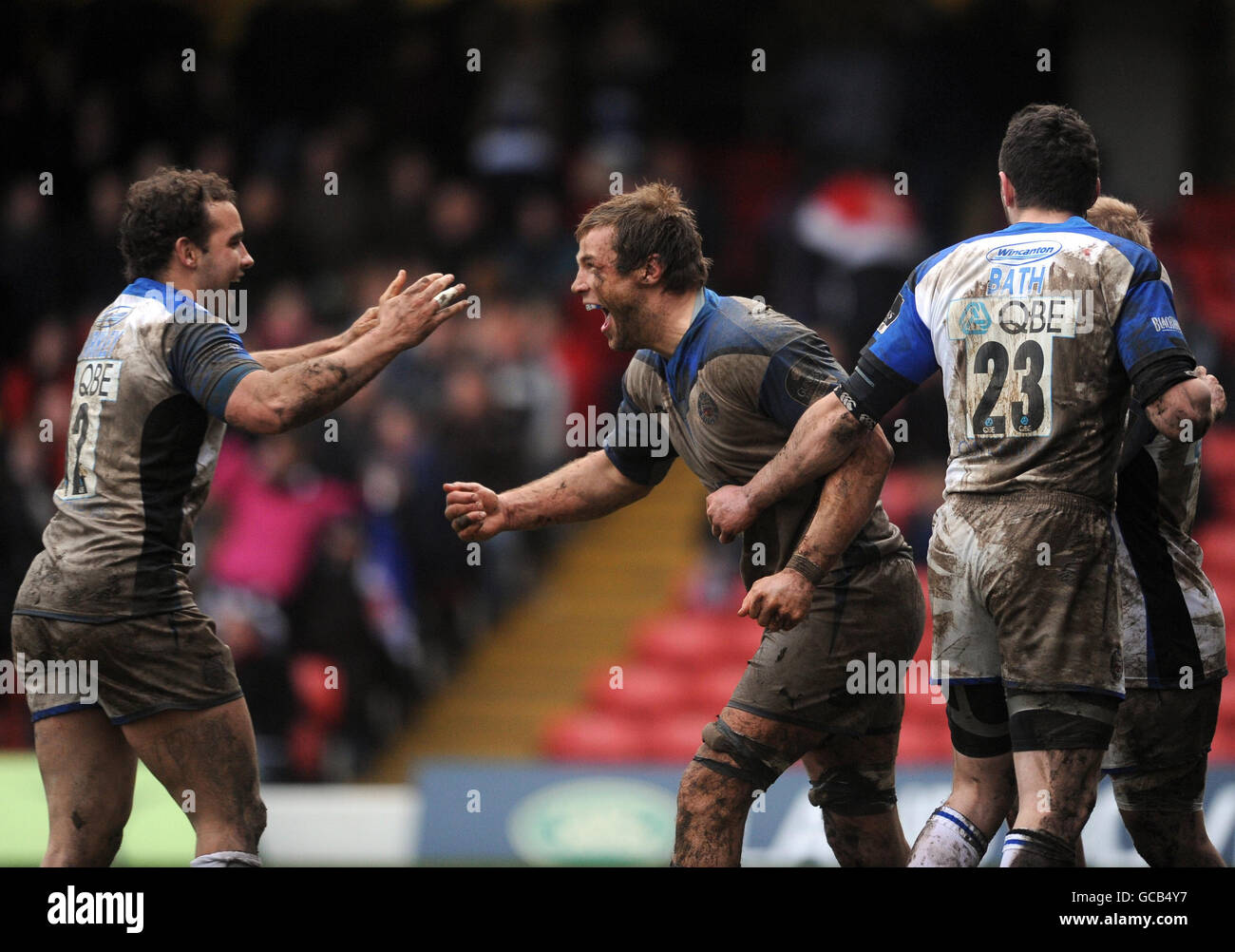 Bath players celebrate as Saracens Derick Hougaard misses a kick to ...