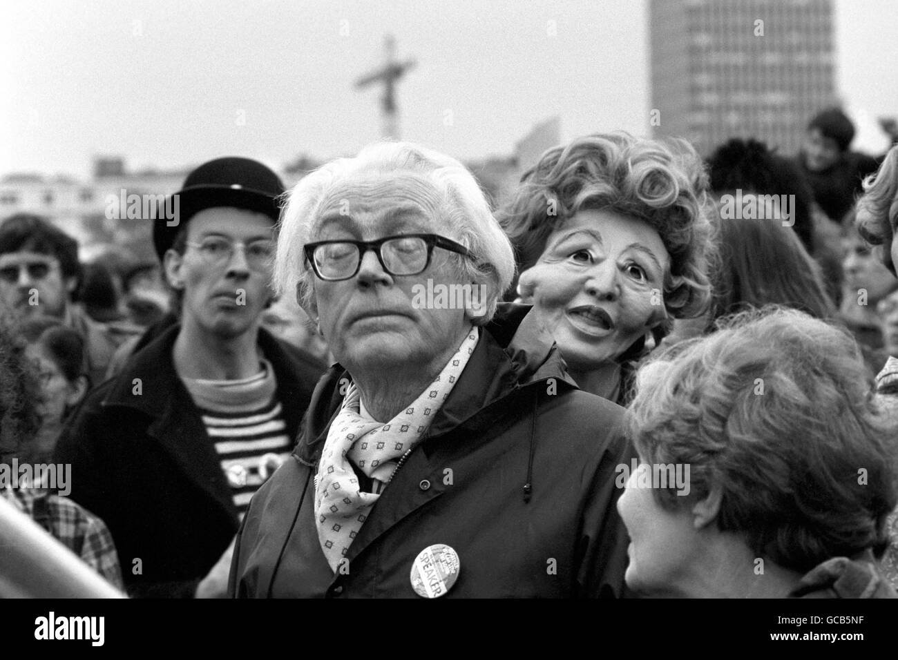 Labour Party leader Michael Foot, with a woman in a Margaret Thatcher ...