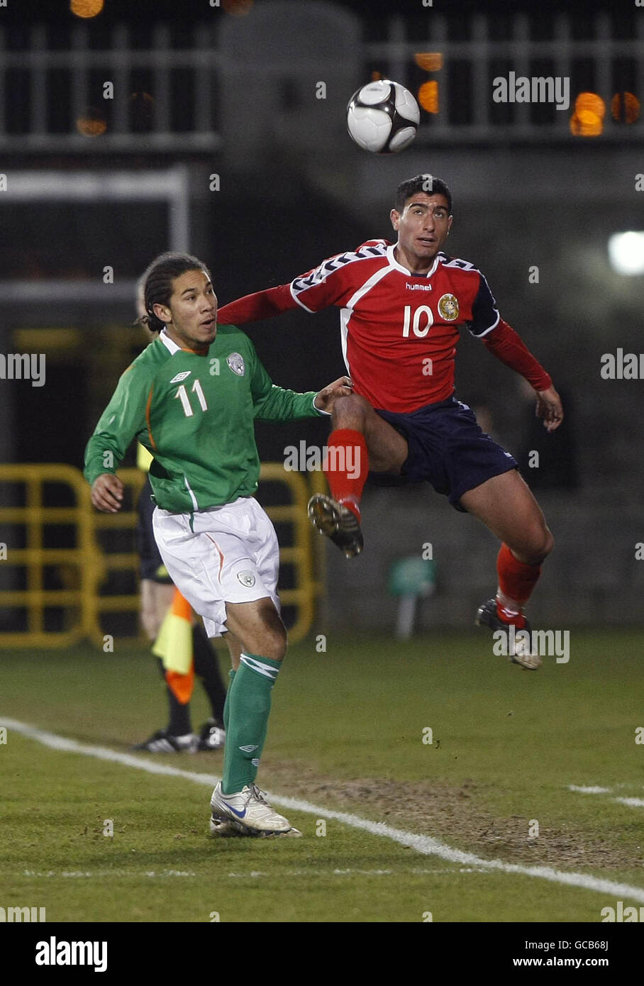 Ireland's Sean Scannell and Armenia's Gevorg Ghazaryan (right) battle ...