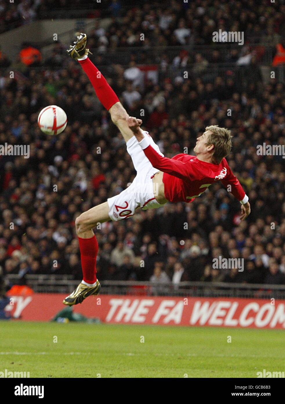 England's Peter Crouch fails an attempt to do an over-head scissor kick ...