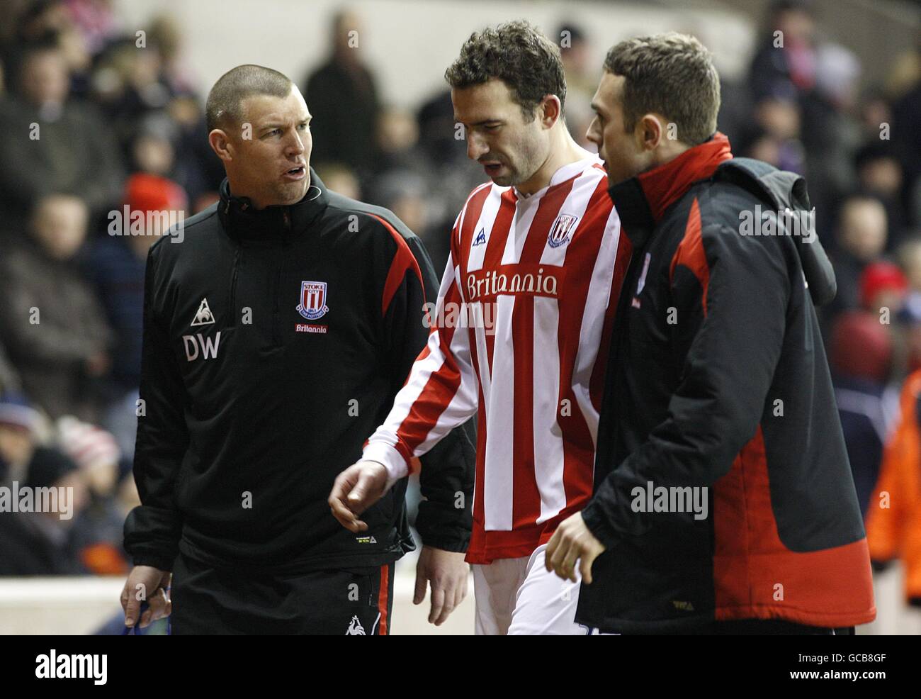 Stoke City's Danny Higginbotham leaves the pitch injured Stock Photo ...