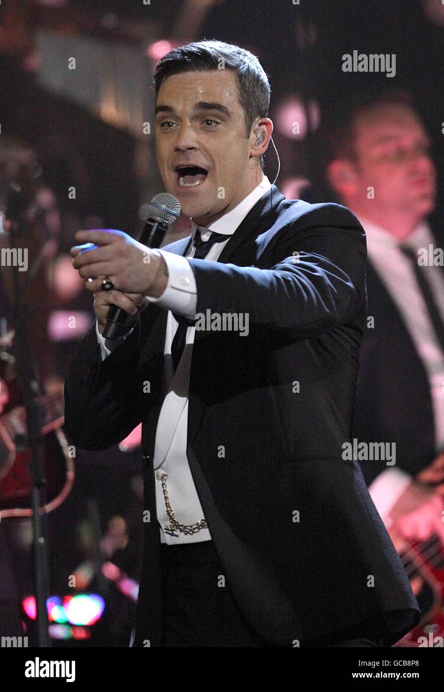 Robbie Williams performs on stage during the BRIT Awards 2010, at Earls ...