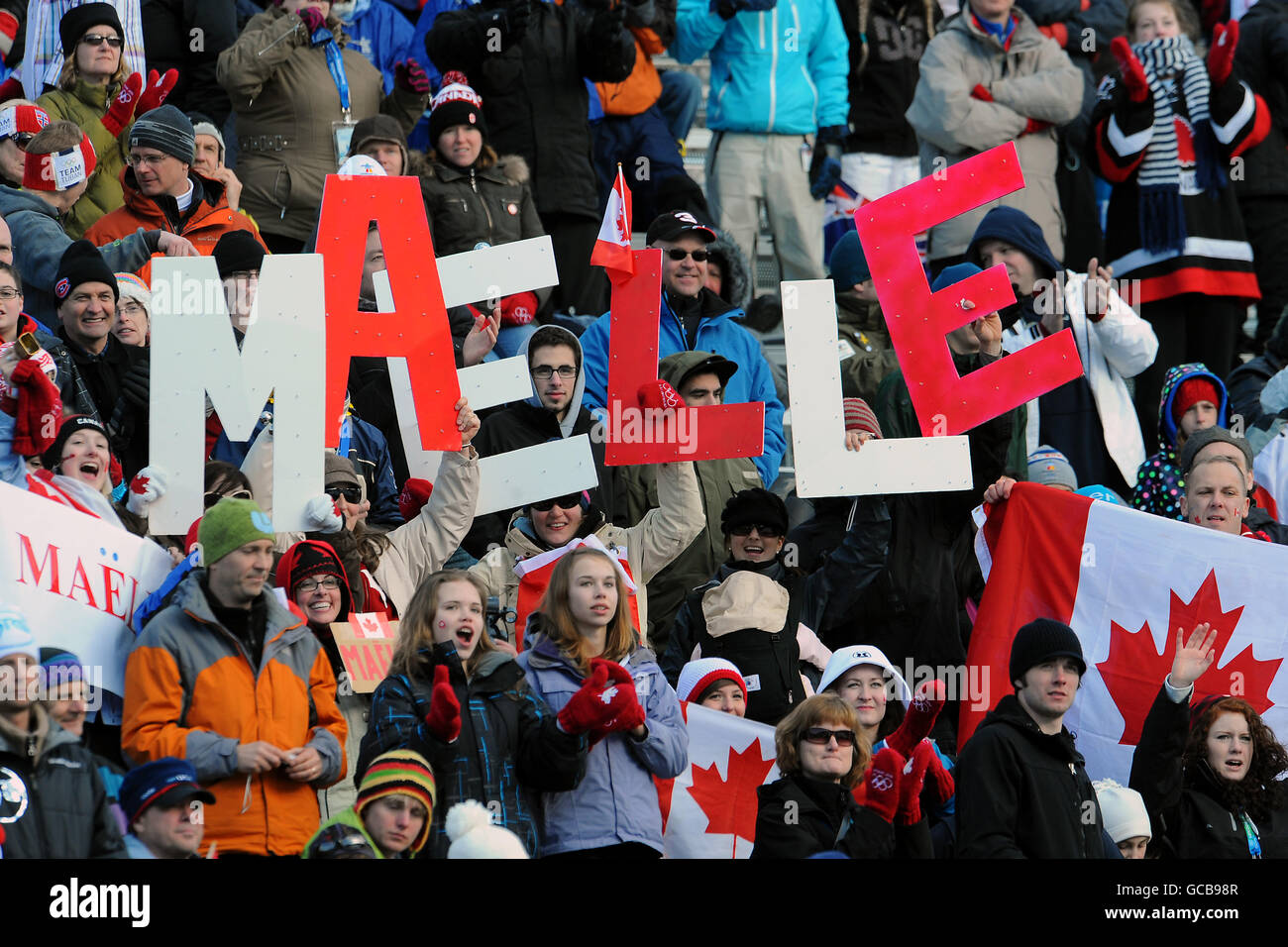 Canads fans cheer on Maelle Ricker in the Ladies' Snowboard Cross Stock ...
