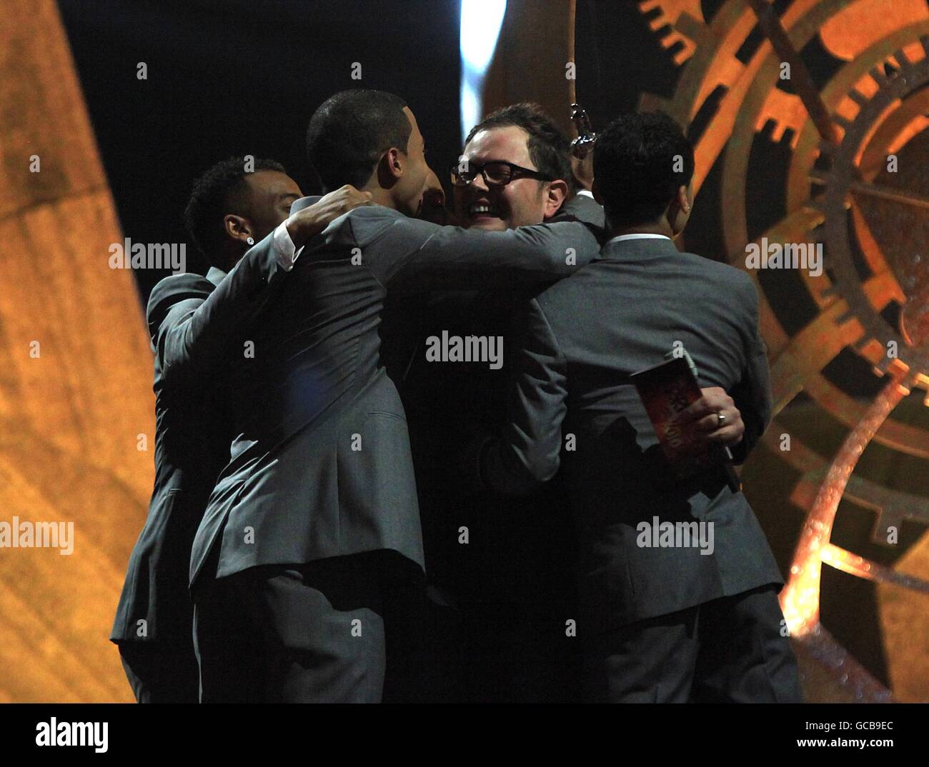 JLS hug Alan Carr as they celebrate winning the award for British ...
