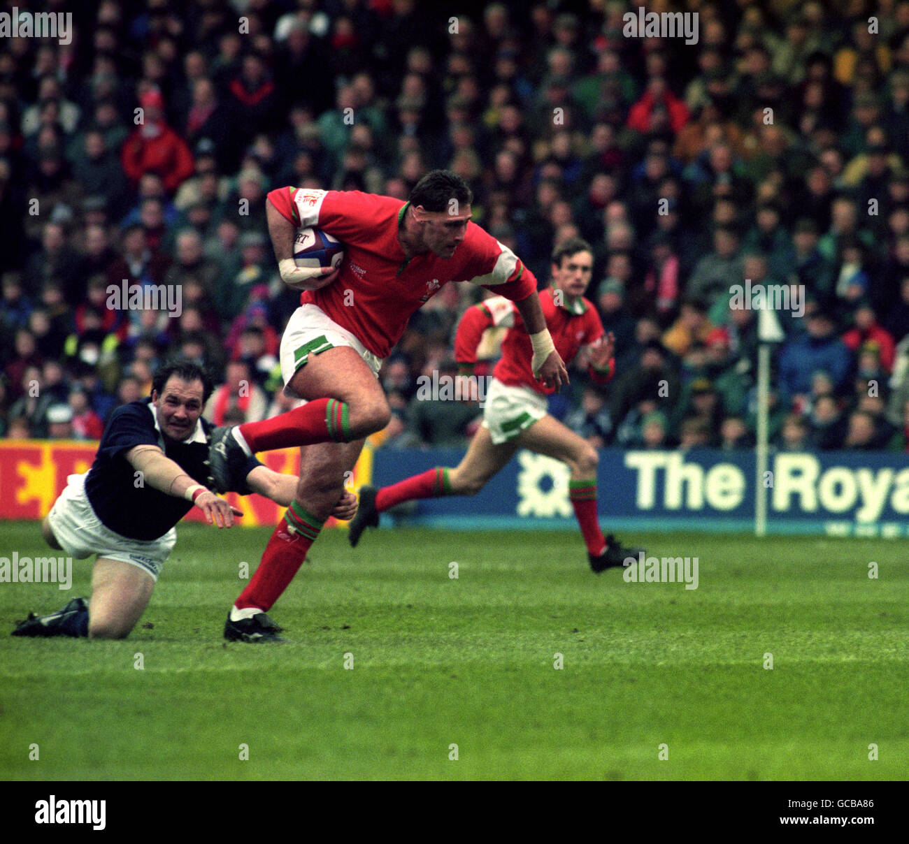 Iain Morrison, of Scotland, tries to stop the six-foot ten-inch ...