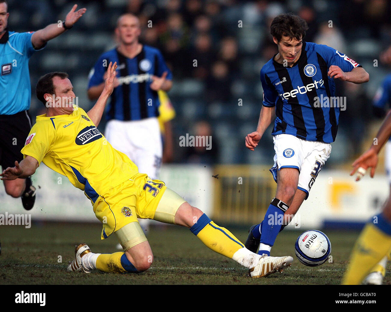 Dagenham and Redbridge's Peter Gain and Rochdale's Will Atkinson battle ...