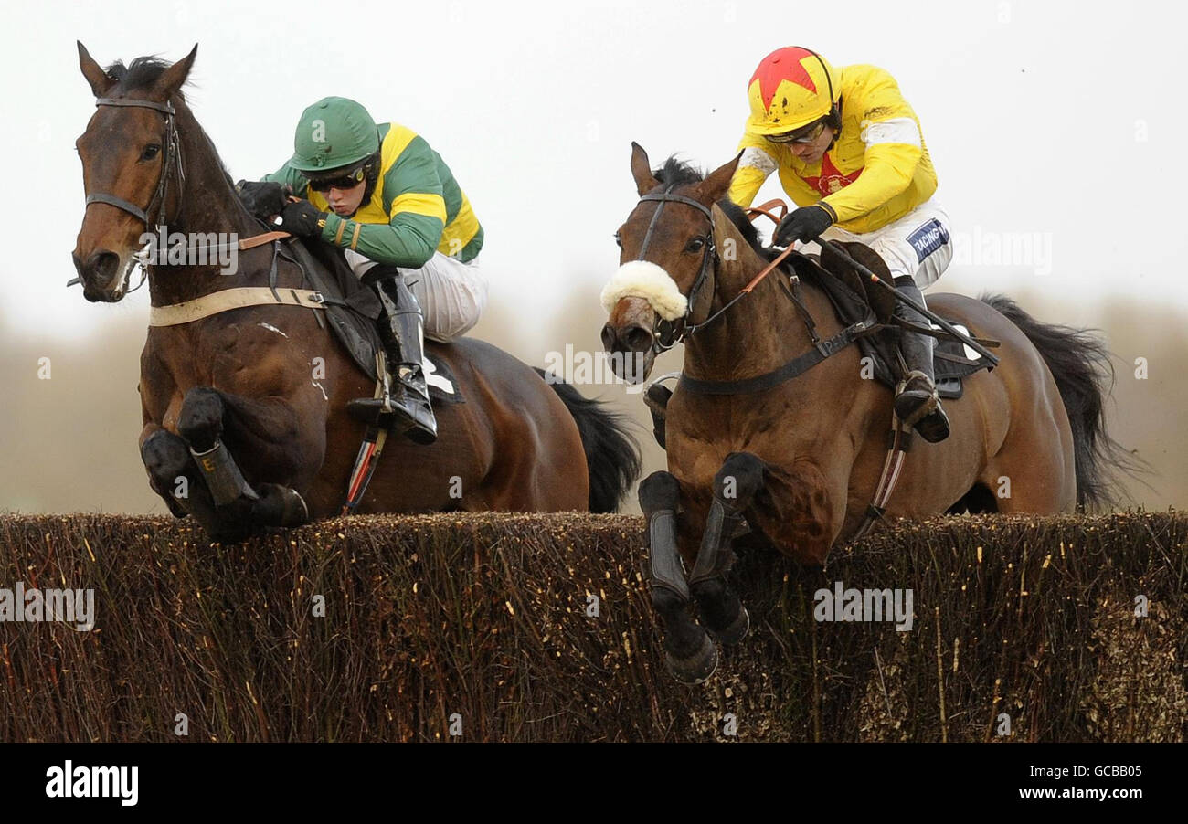 Panjo Bere and Joshua Moore (left) jump the last with I ...
