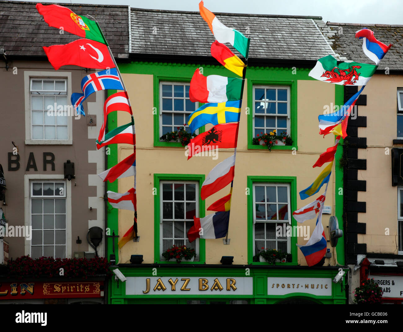 Flags flying outside Jayz Bar, Main Street, Carrickmacross Stock Photo ...