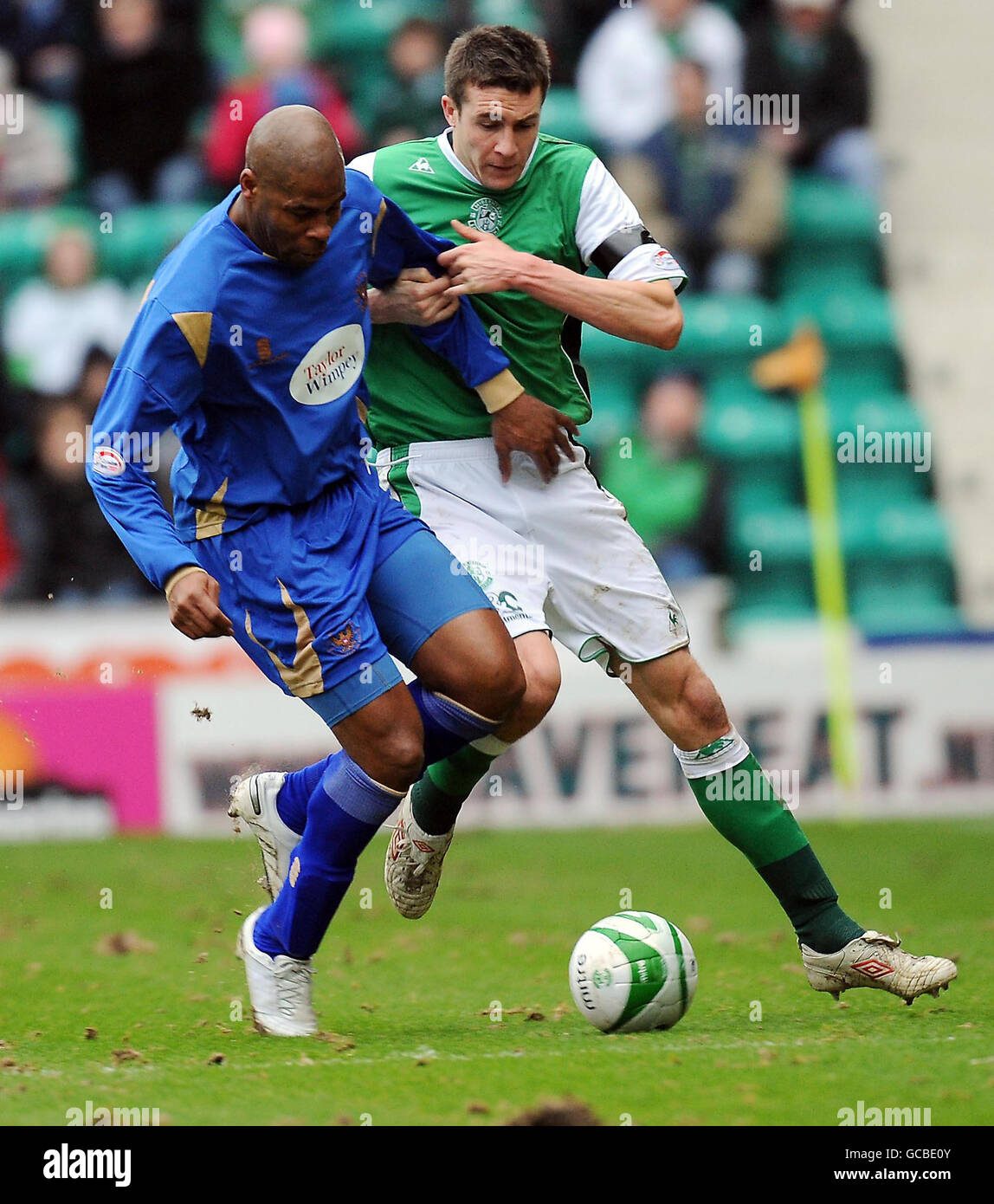 Hibernian's Colin Nish and St Johnstones Michael Duberry battle for the ...