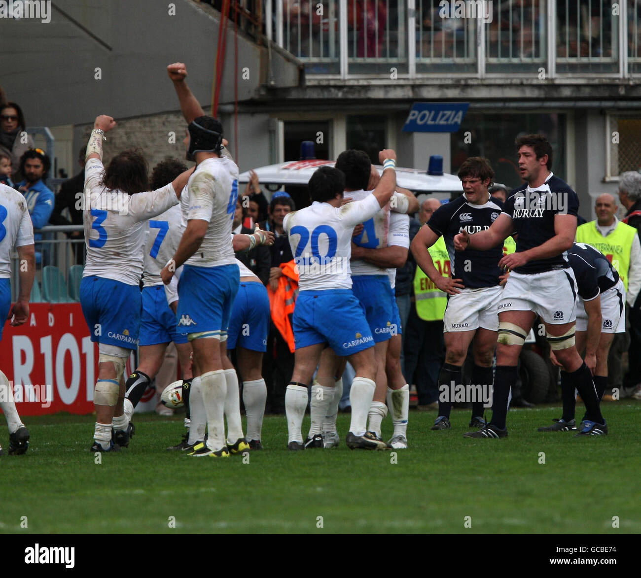 Italy's team celebrate as Scotland's Ross Ford and Nathan Hines are ...