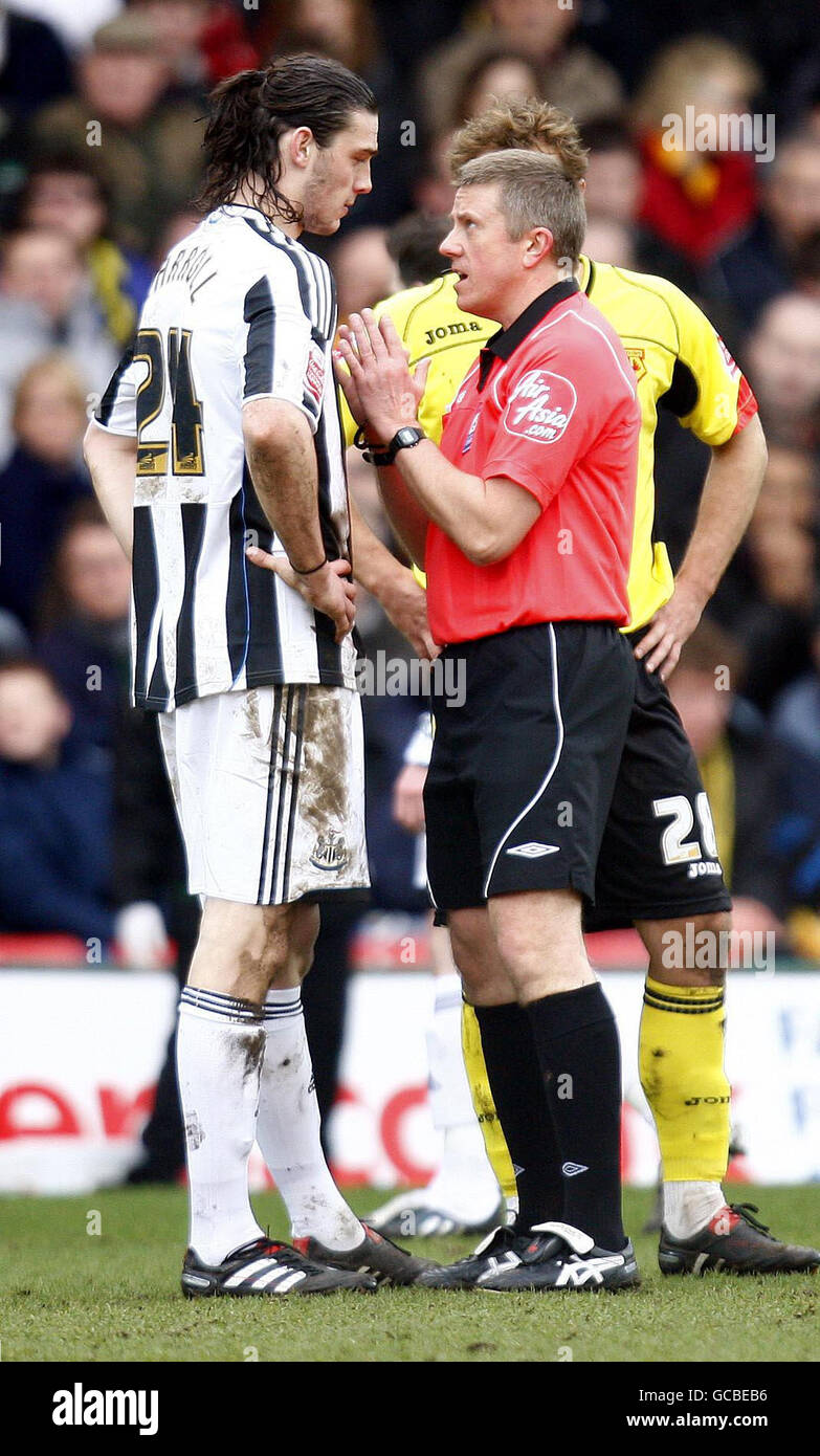 Newcastle's Andrew Carroll talks to referee Tony Bates (right) during ...